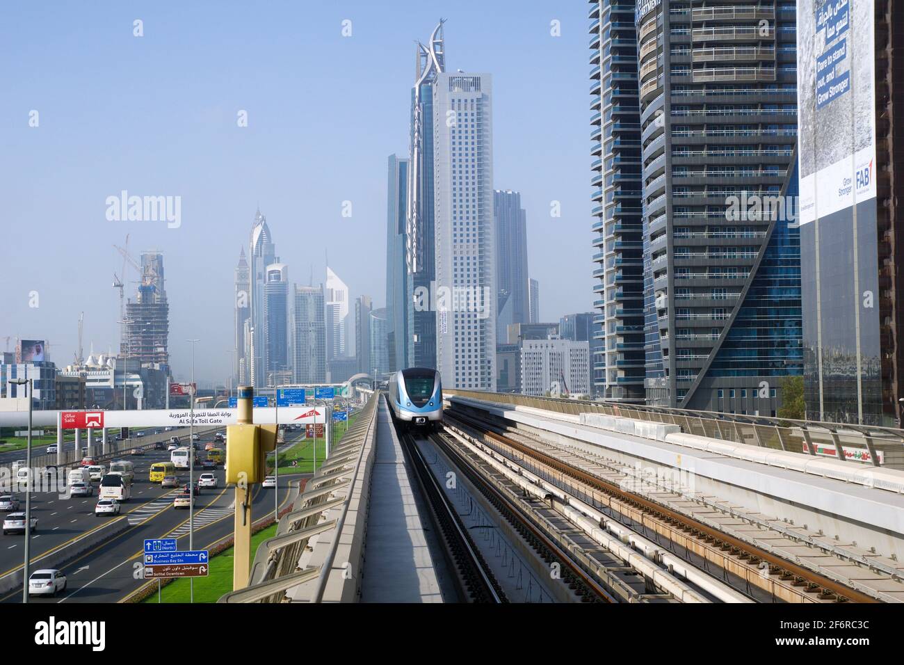 DUBAI, UNITED ARAB EMIRATES - JUN 19, 2019: Metro Dubai train with city ...
