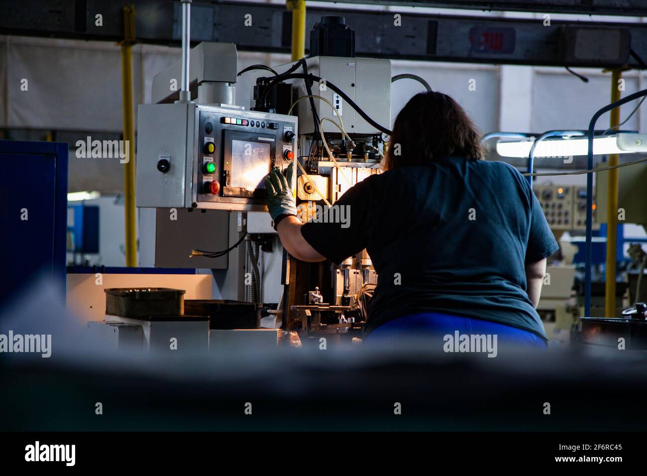 Stepnogorsk, Kazakhstan. Bearing production plant. Operator woman and ...