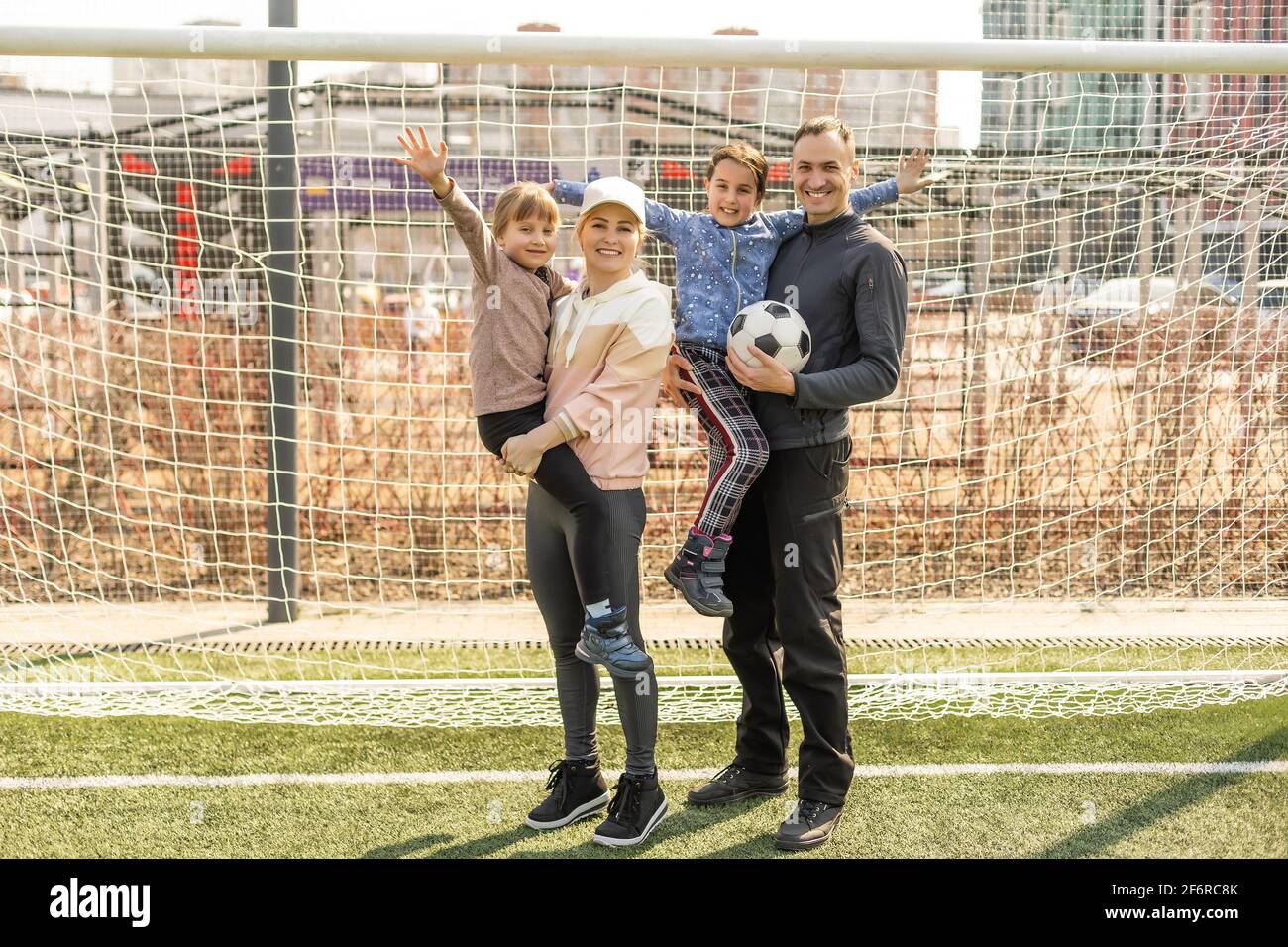 family with soccer ball in stadium Stock Photo - Alamy