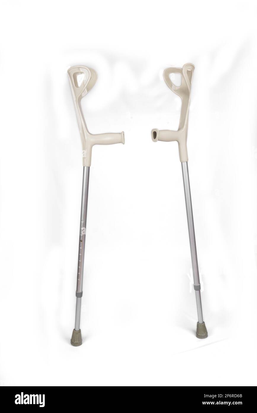 Metal elbow Crutches on a white background Stock Photo - Alamy