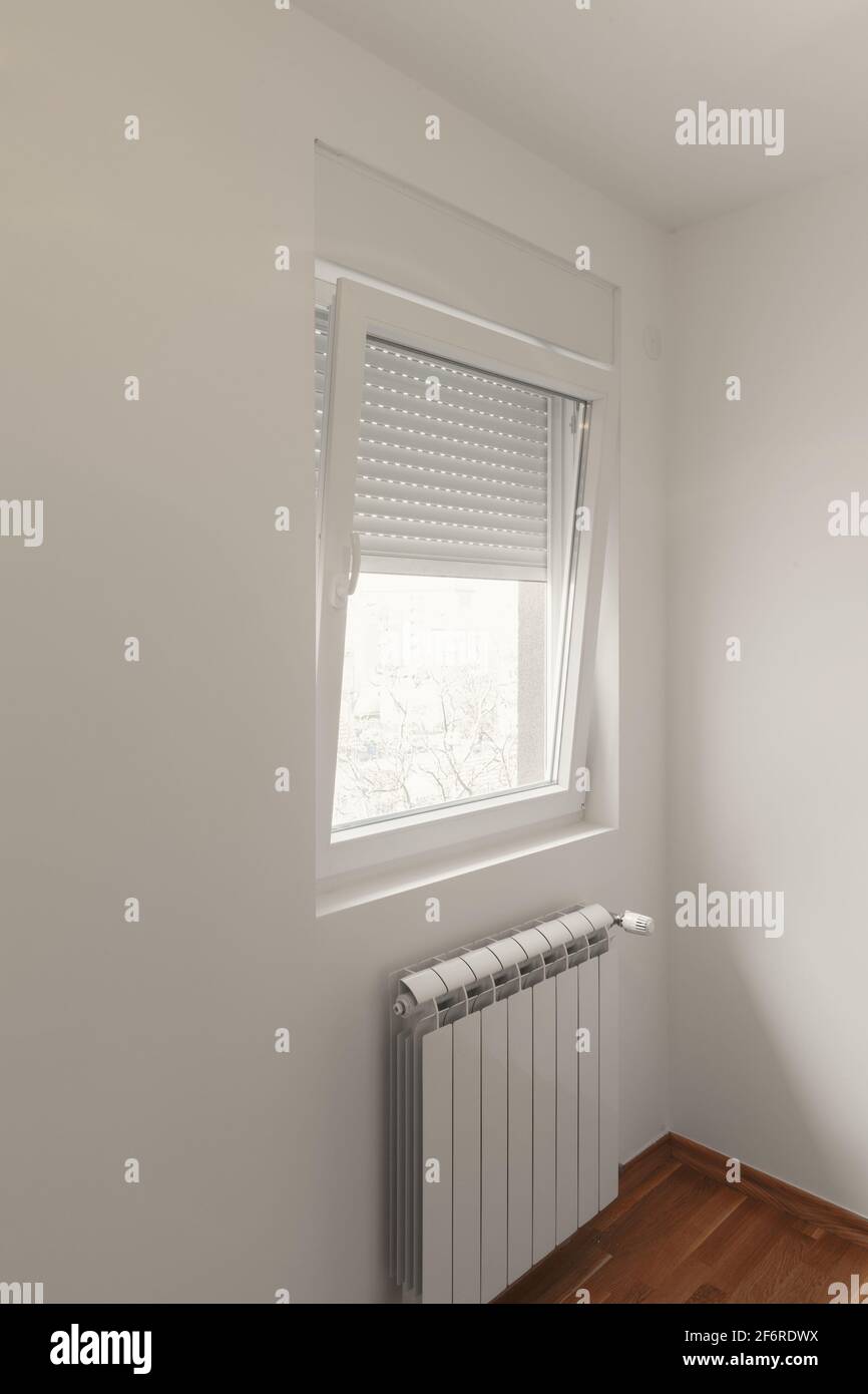 empty room with two windows and parquet Stock Photo - Alamy