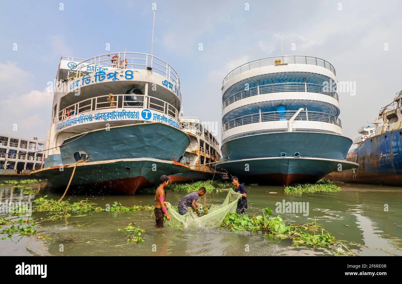 Dhaka, Bangladesh - 27th October 2018 : The Buriganga river is always busy with wooden boats and ...