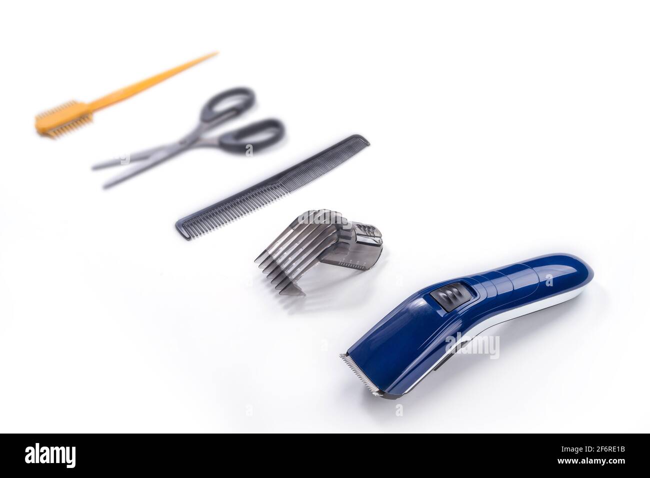 Hair trim machine and accessories on a white background Stock Photo - Alamy