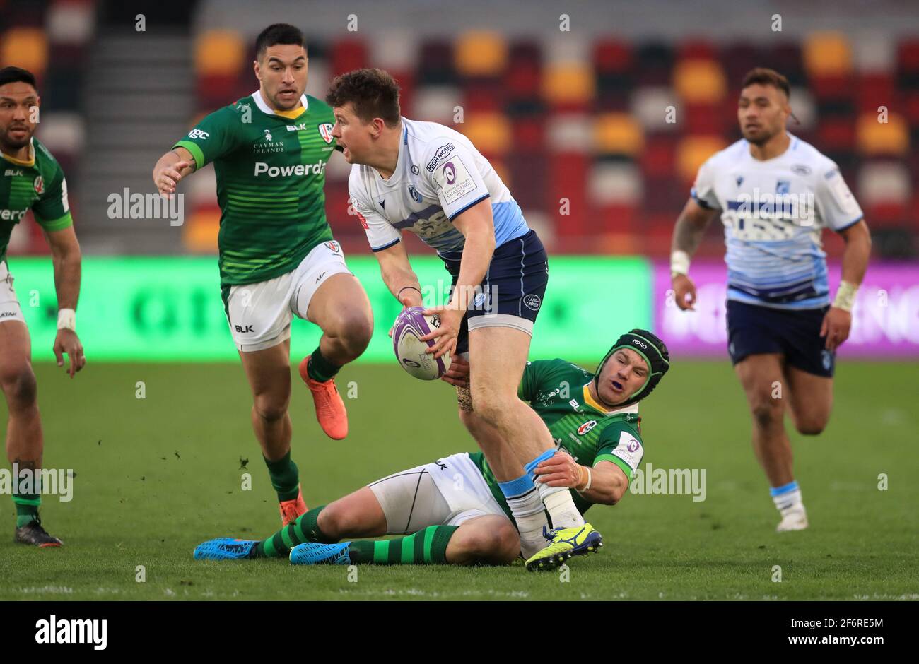 Cardiff Blues' Jason Harries is tackled before offloading the ball to ...