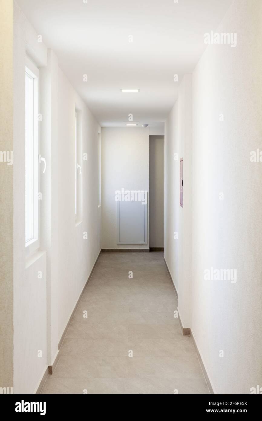 hallway in the building, white walls and windows Stock Photo - Alamy
