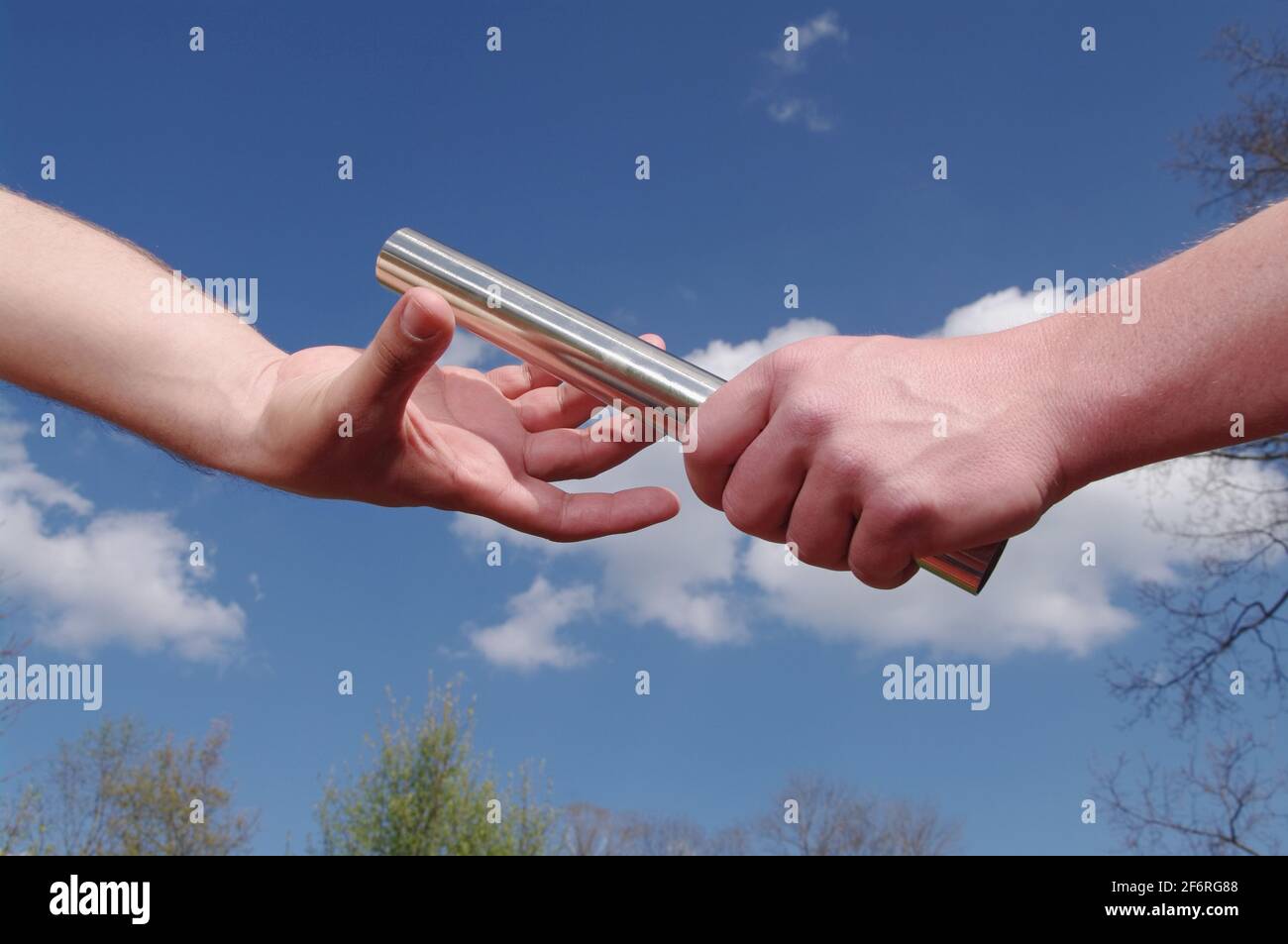 Relay race exchange baton hi-res stock photography and images - Alamy