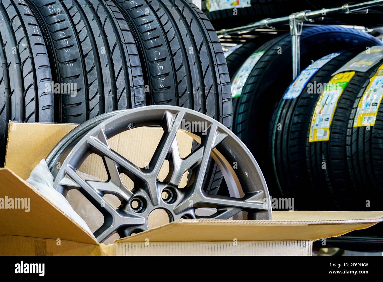 new stylish light alloy material wheel in a cardboard box on a ...