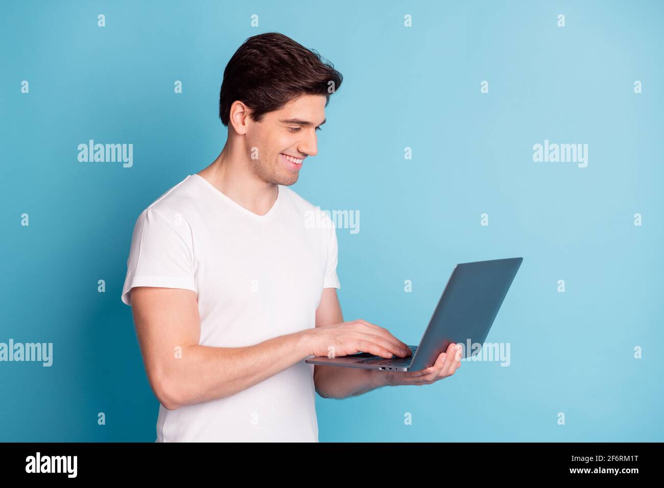 Portrait of cheerful person typing laptop toothy smile read funny ...