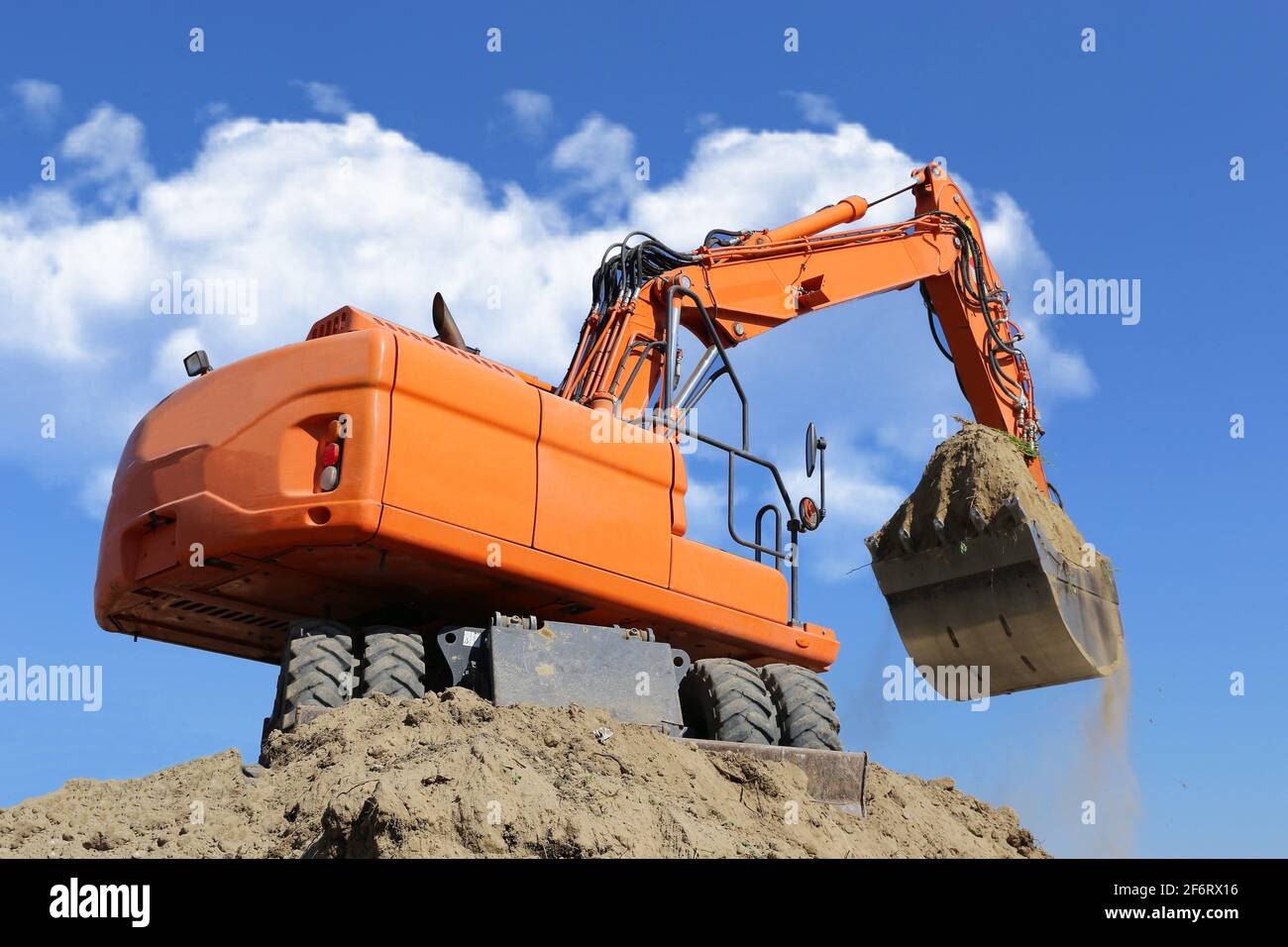 Excavation work with excavator on a building site Stock Photo - Alamy