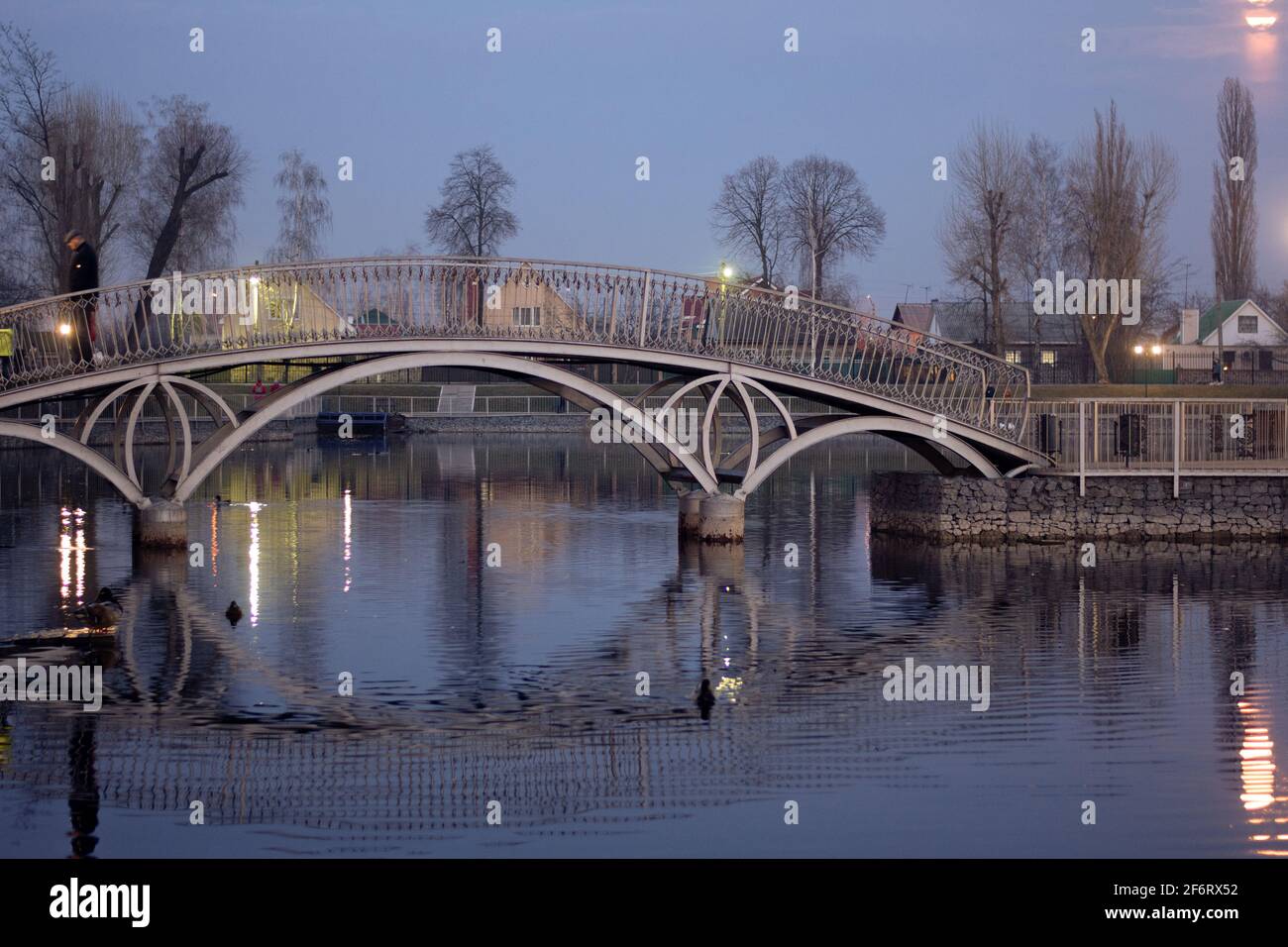 Bridge on an artificial lake in a city park at night Stock Photo - Alamy