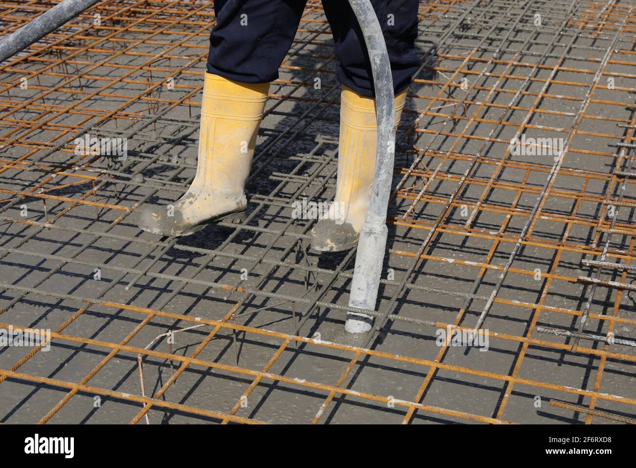 Concreting a base plate with ready-mixed concrete on the construction ...