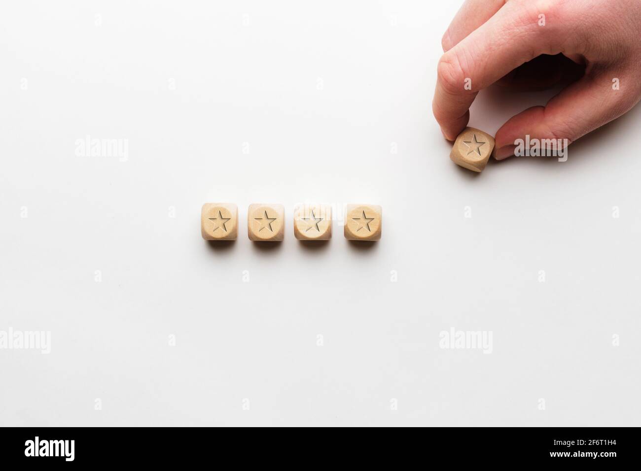 The concept of five-star grading and rating on wooden cubes Stock Photo ...