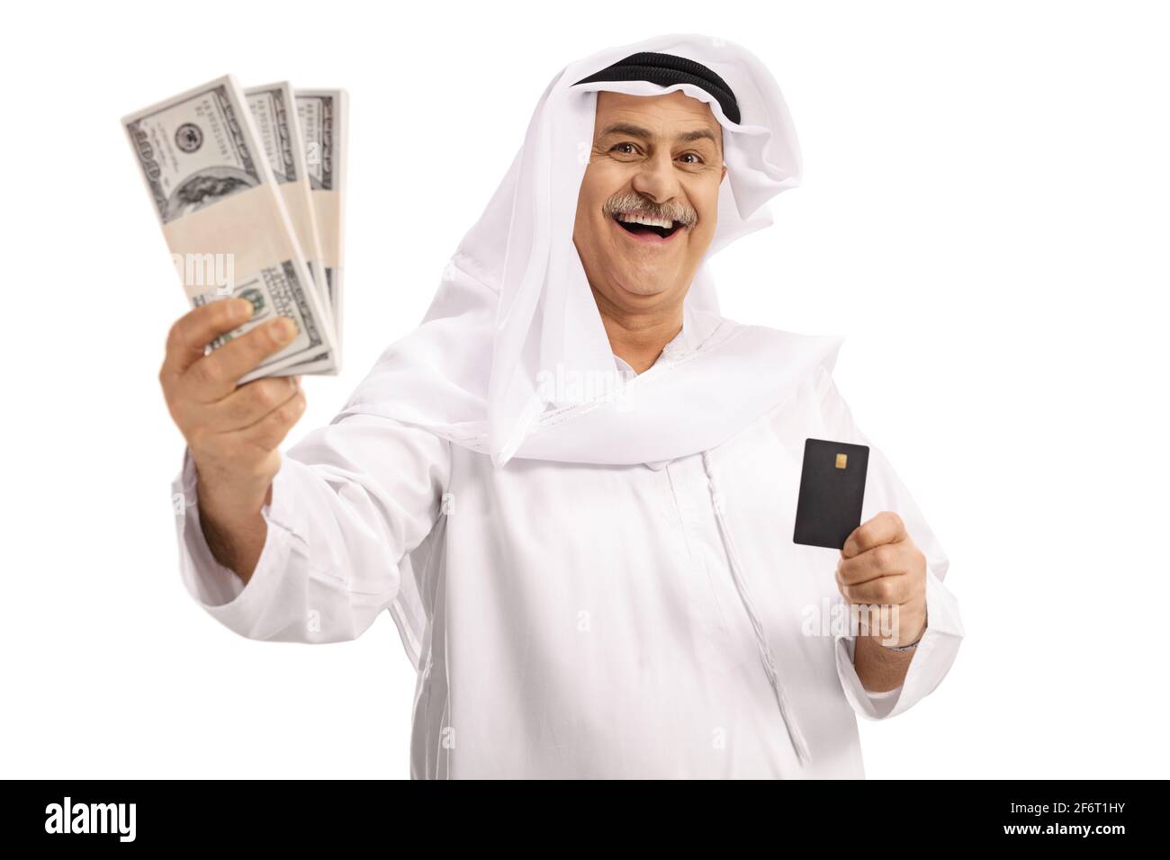 Mature arab man holding stacks of money and a credit card isolated on ...
