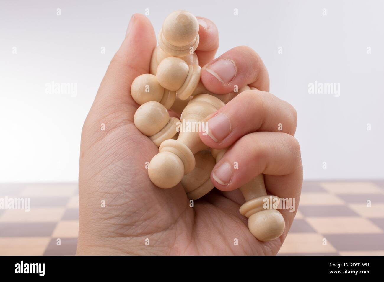 Chess board with chess pieces in the hand Stock Photo - Alamy