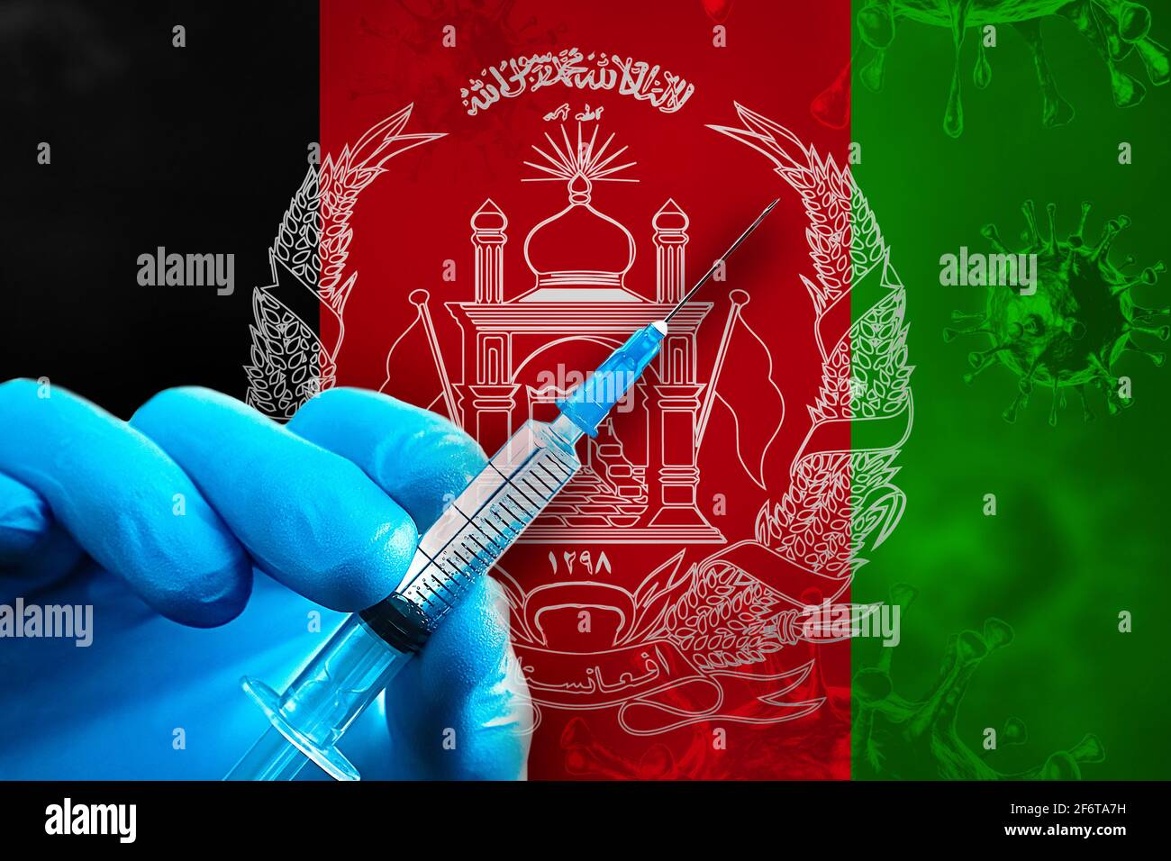 Afganistan Covid-19 Vaccination Campaign. A hand in a blue rubber glove ...