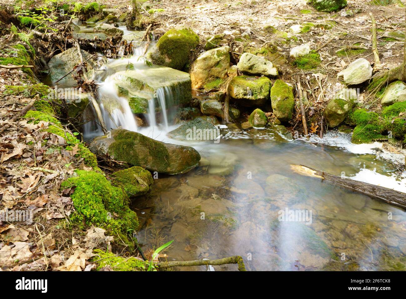 Small creek waterfall into smooth pool long exposure Pennsylvania Stock ...