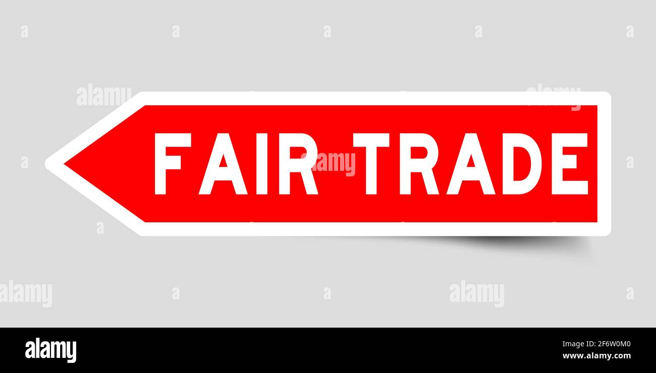 Arrow shape red color sticker in word fair trade on gray background ...