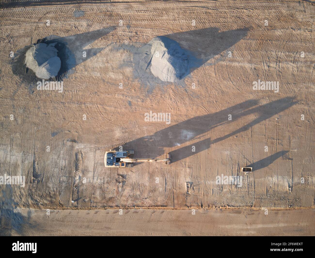 Aerial construction site showing earth moving equipment for a ...