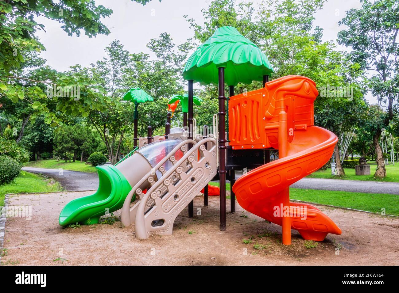 Colorful playground equipment in the public park Stock Photo - Alamy