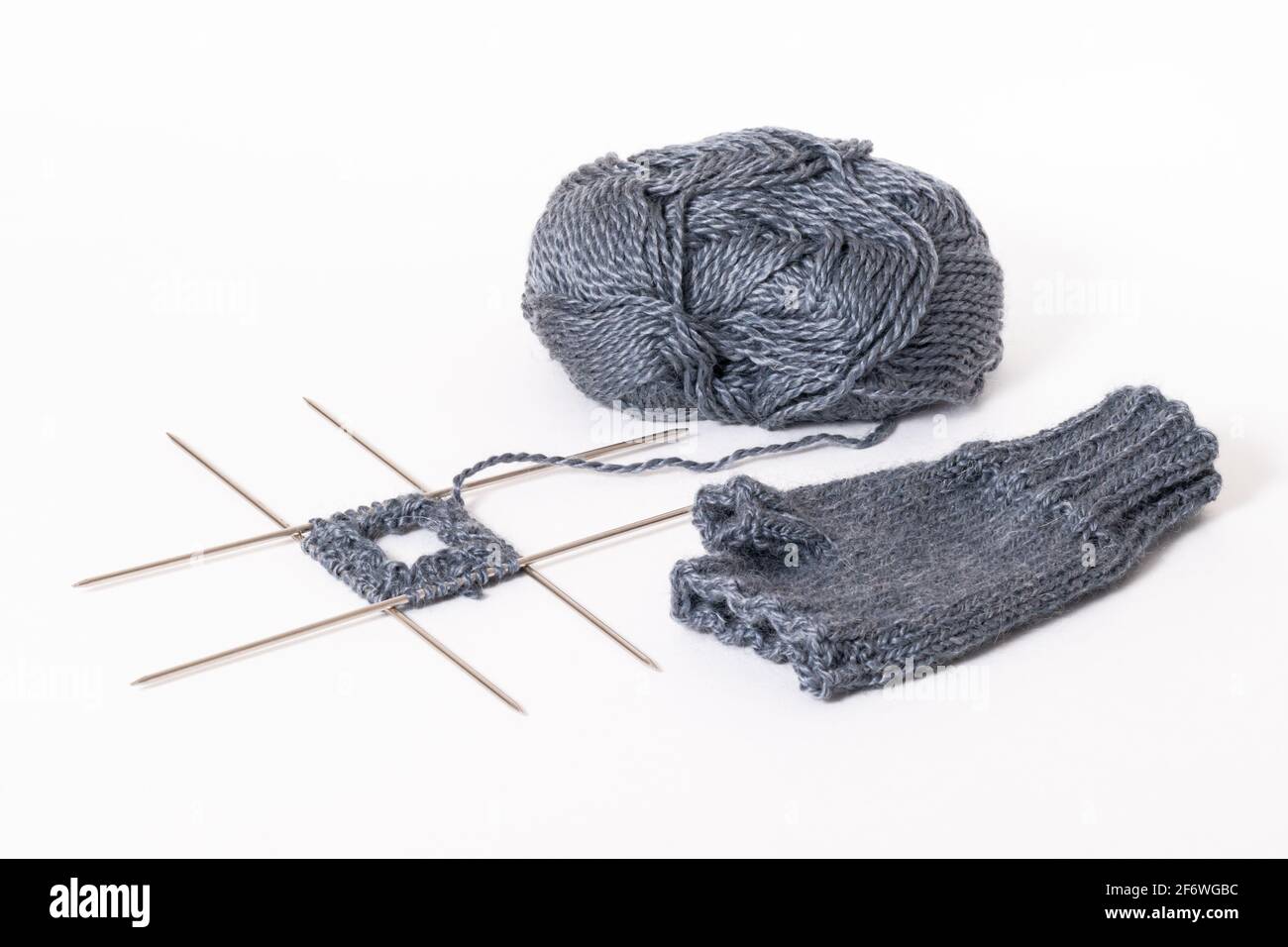 Still life of knitting on knitting needles, ball of wool, ready-made ...