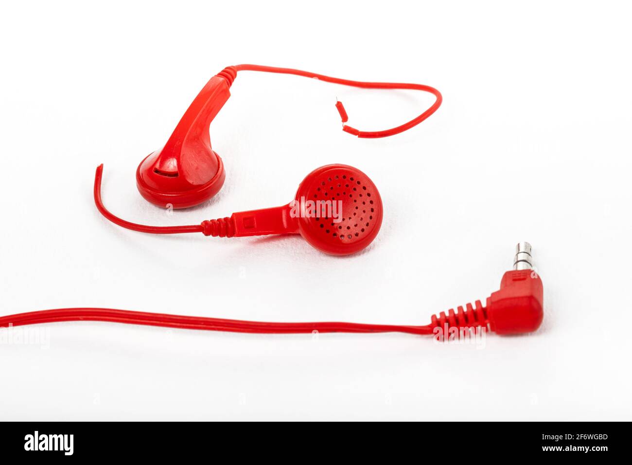 Headphones on a white background. Torn headphones. Repair of electronic ...