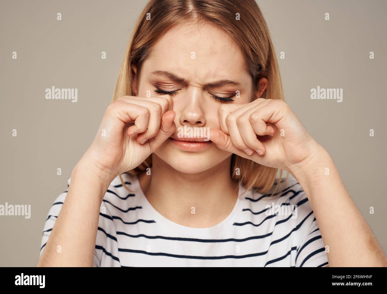 upset woman crying on beige background emotions cropped view Stock ...