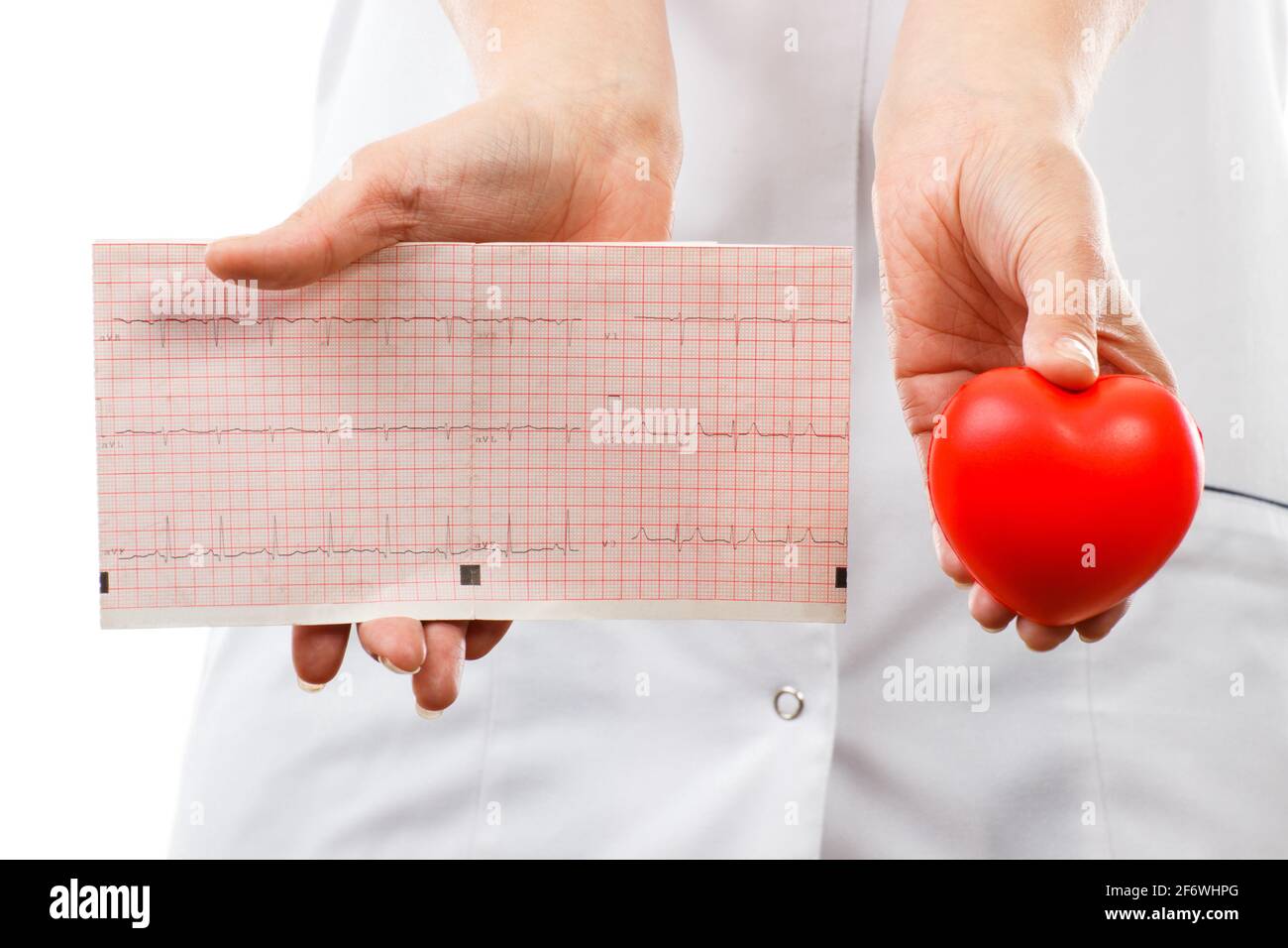 Doctor cardiologist in white apron with stethoscope holding ...