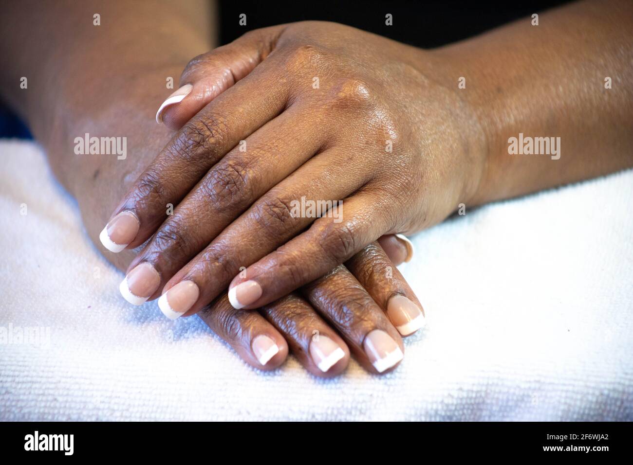 Lady's Hands with New Nails and lotion Stock Photo - Alamy