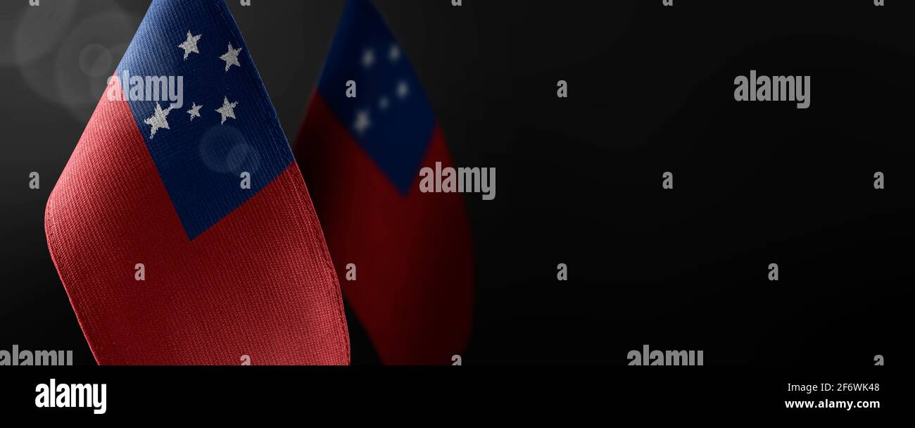 Small national flags of the Samoa on a dark background Stock Photo - Alamy