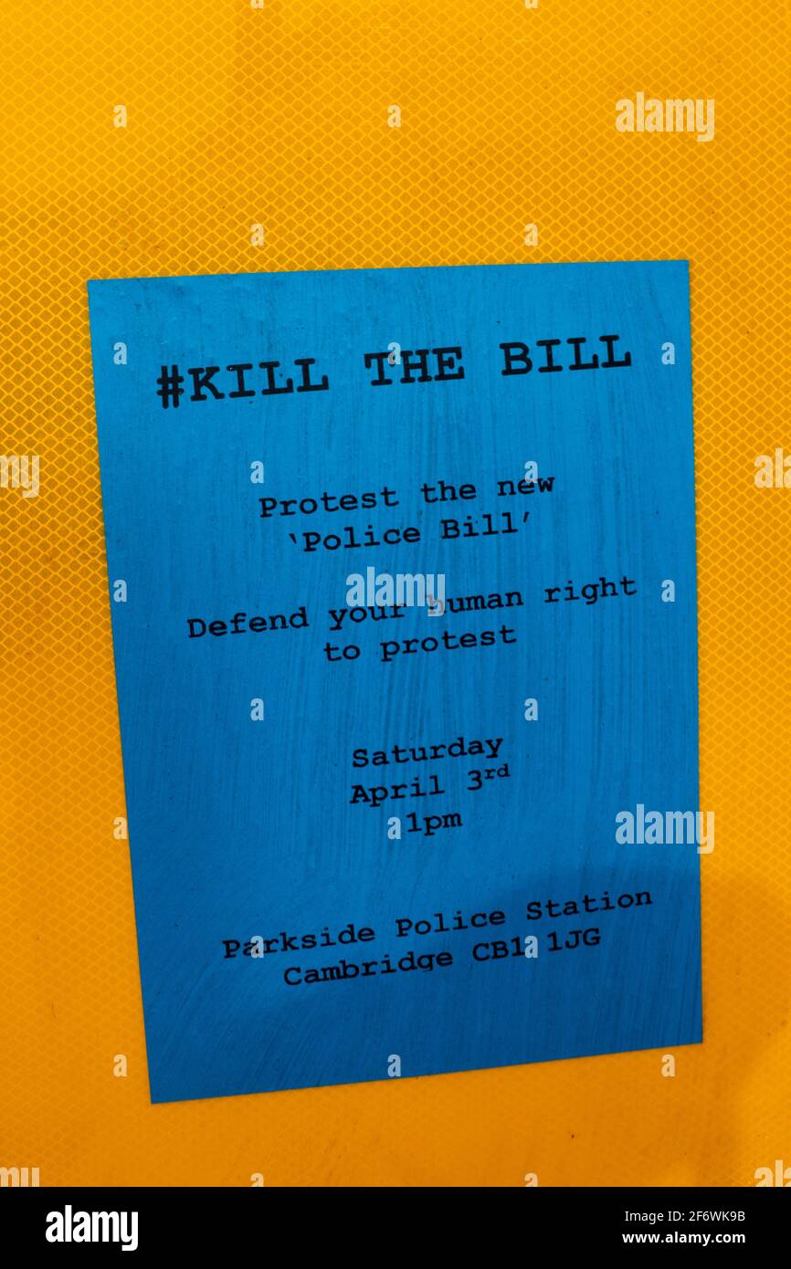 A blue poster on a reflective yellow background showing details of a ...