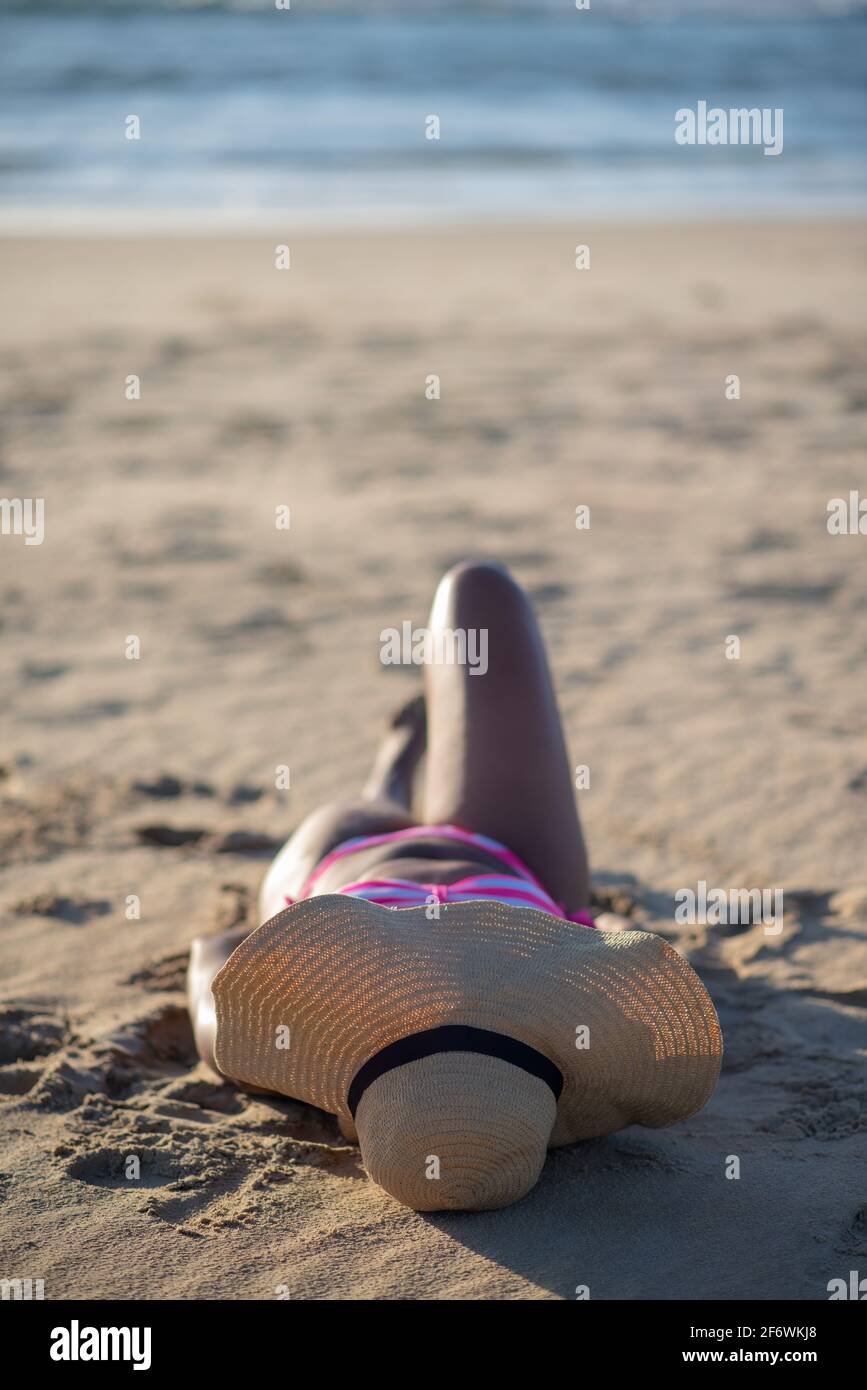 Single person laying and sunbathing outdoors Stock Photo - Alamy