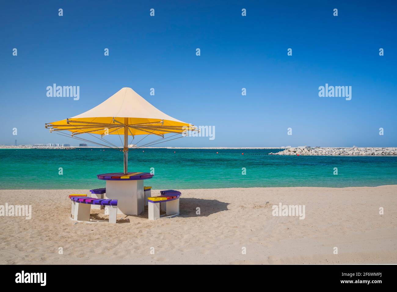 Beach umbrella and seats on the seaside Stock Photo - Alamy