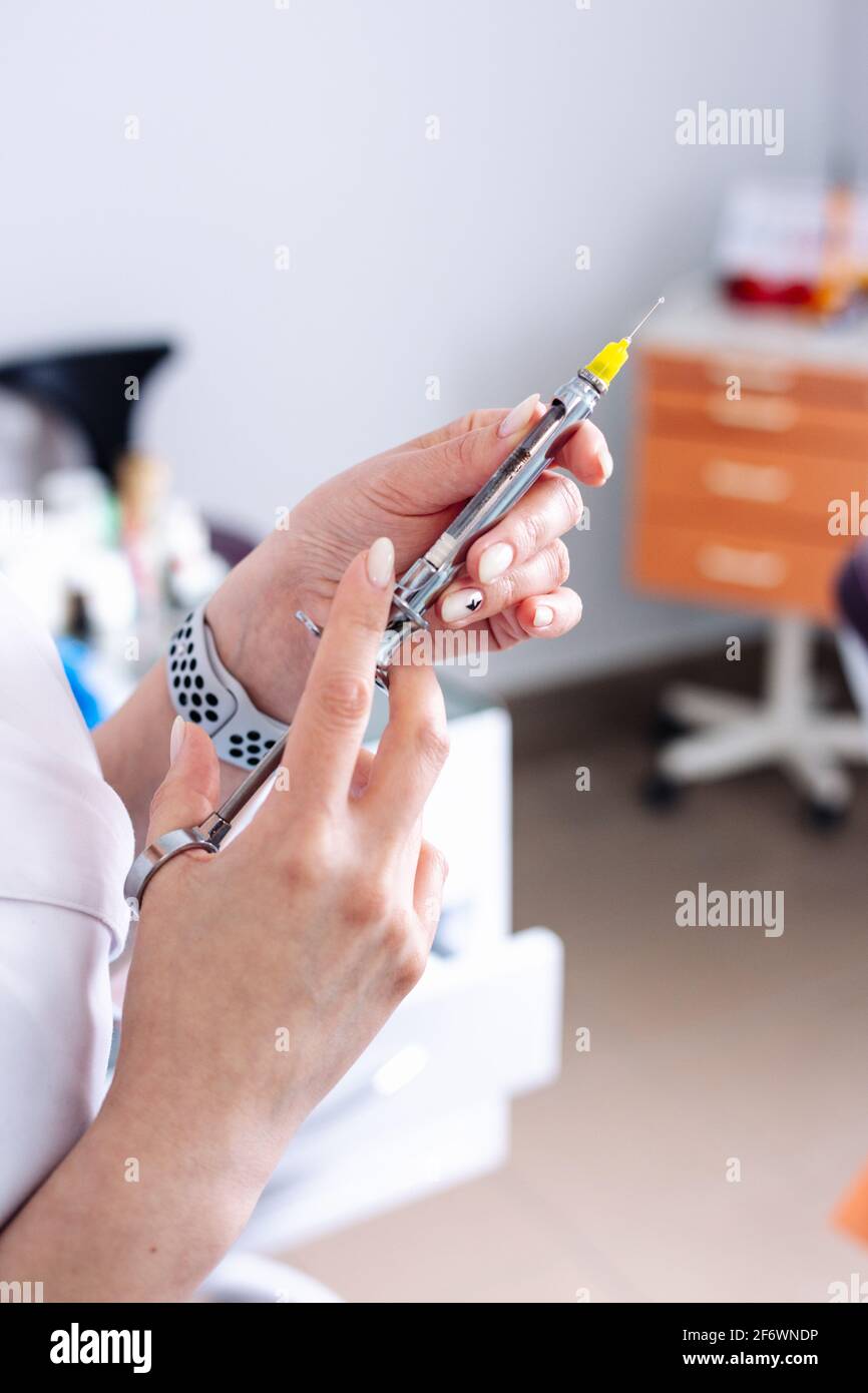 Female hands with a syringe for injection. Vaccination Stock Photo - Alamy