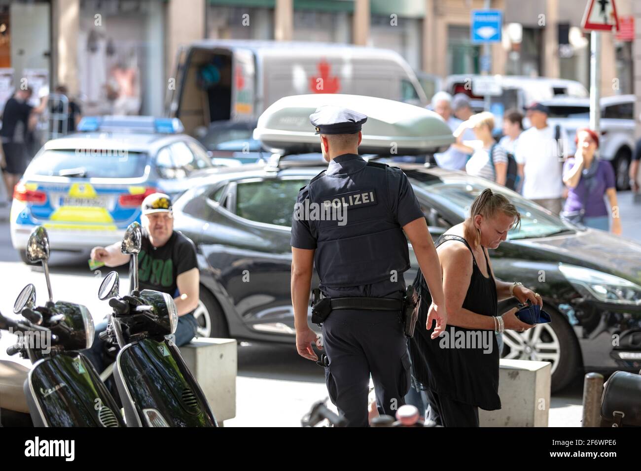 German policemen checking ID documents on the streets in Munich ...