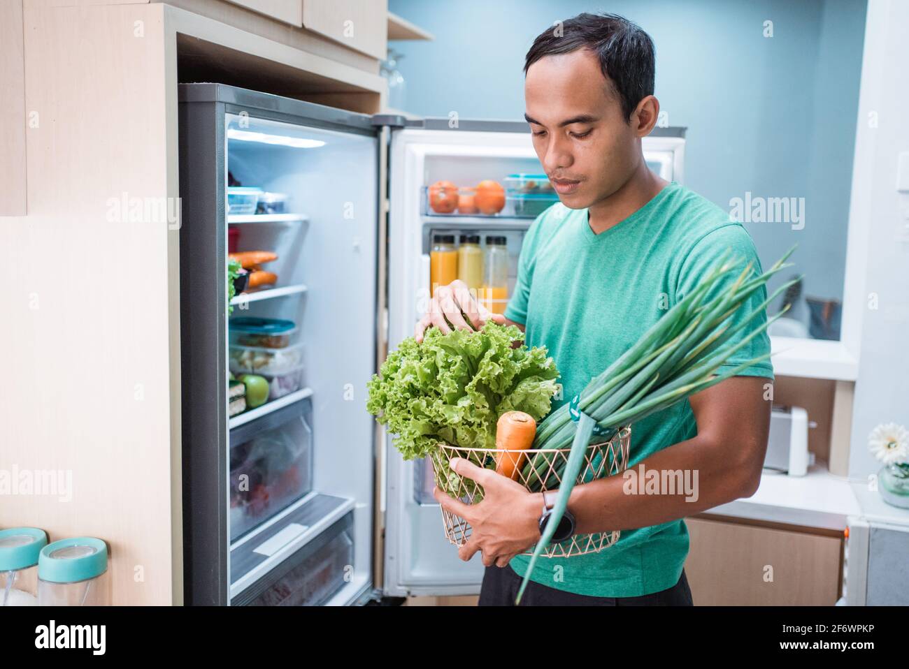 Cook opening kitchen door hi-res stock photography and images - Alamy