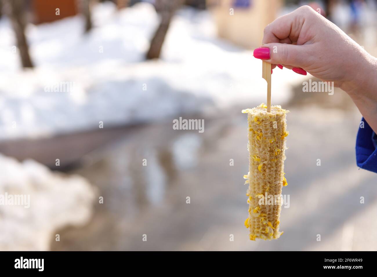 A gnawed cob of freshly boiled corn. Fast food concept Stock Photo - Alamy