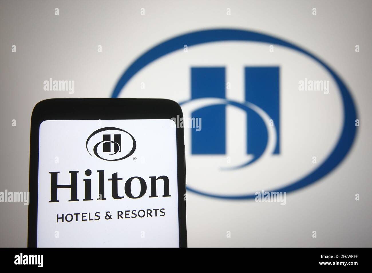 In this photo illustration a Hilton hotels and resorts logo is seen on ...