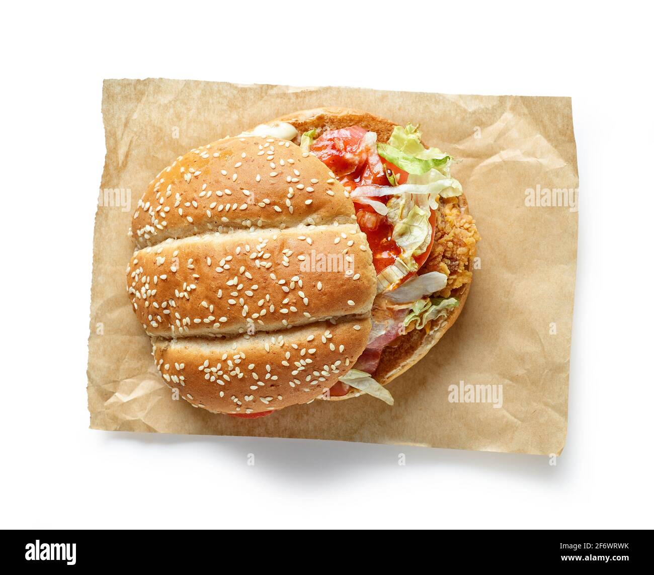 fresh tasty burger on paper sheet isolated on white background, top ...