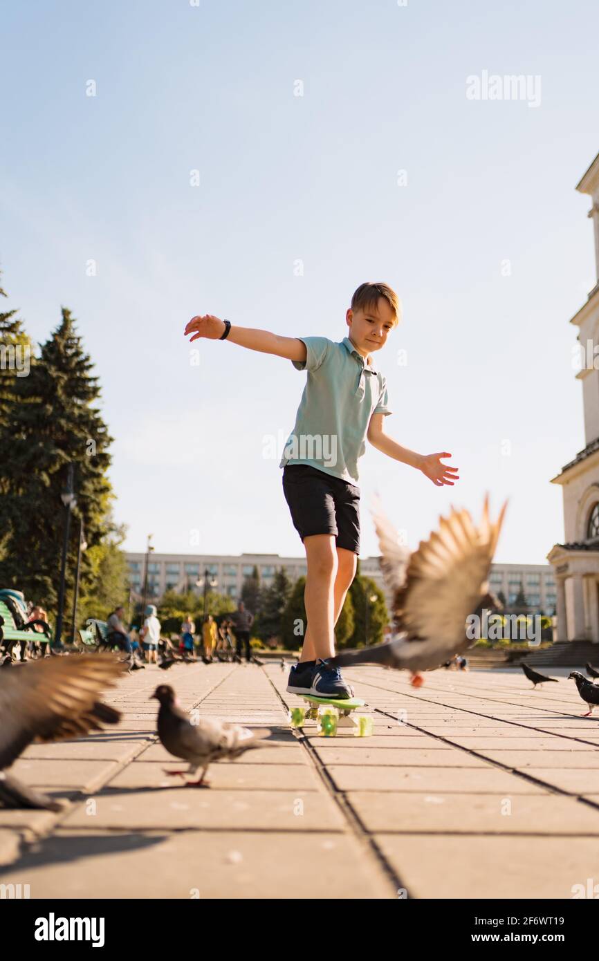 Riding penny board hi-res stock photography and images - Alamy