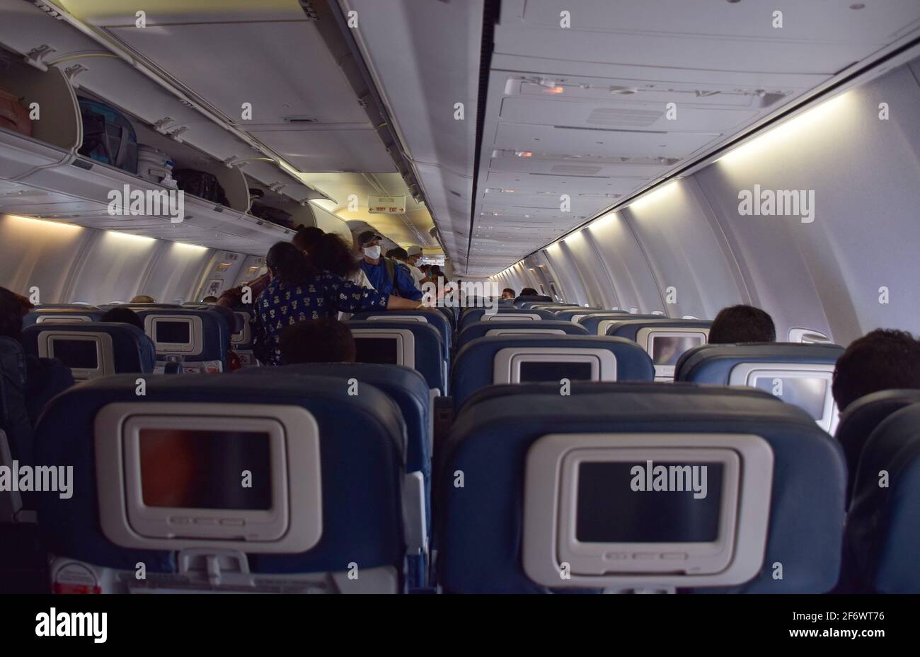 Inside of a passenger aircraft or plane with LED screen fitted with ...