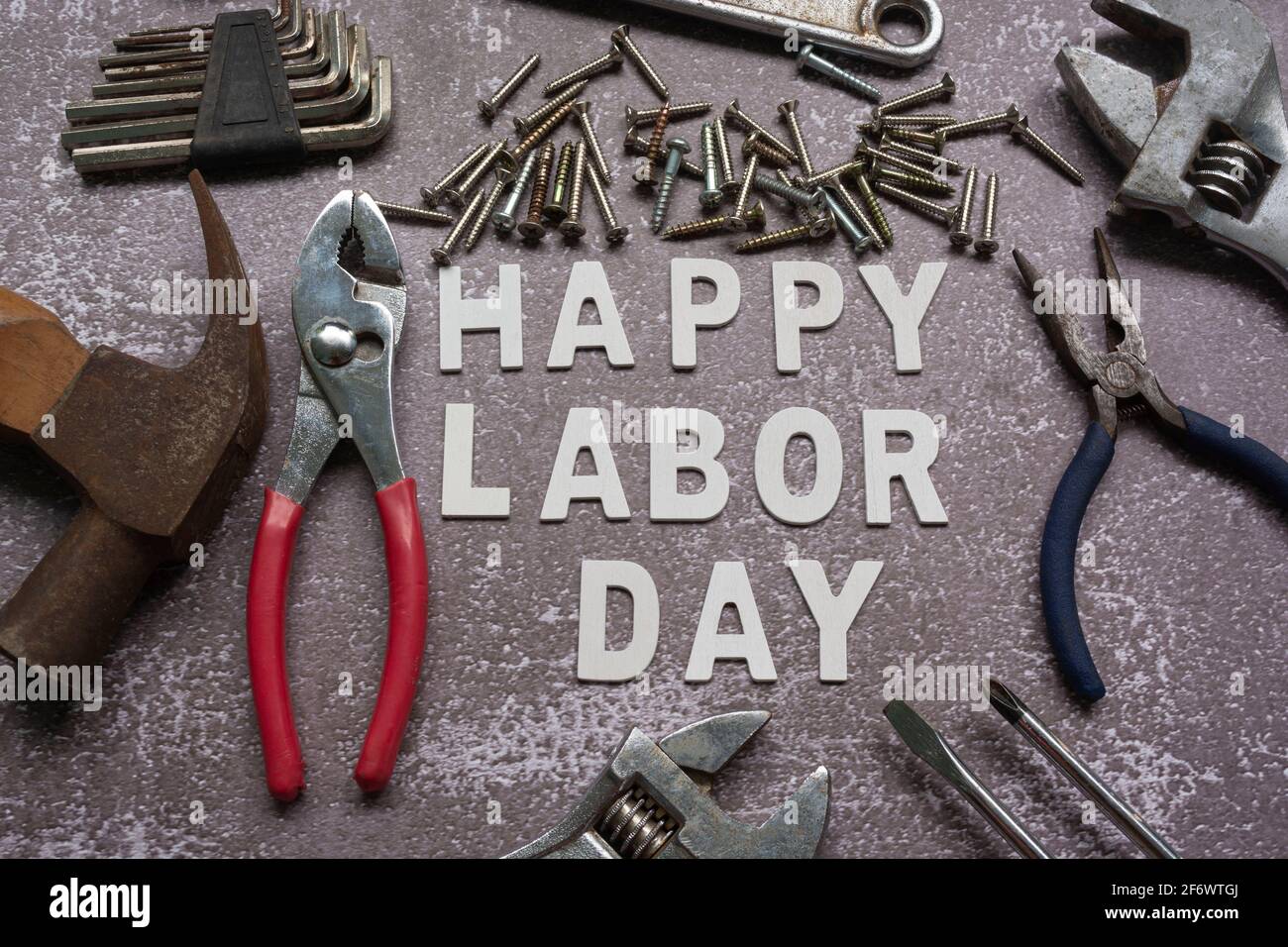 Happy labor day text with repair equipment and many handy tools on ...