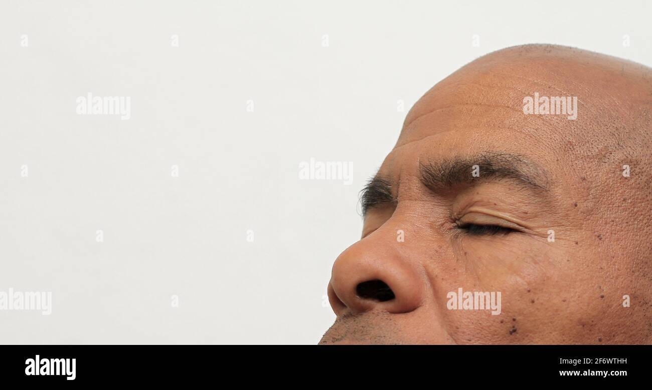man praying to god with eyes open Caribbean man praying with white ...