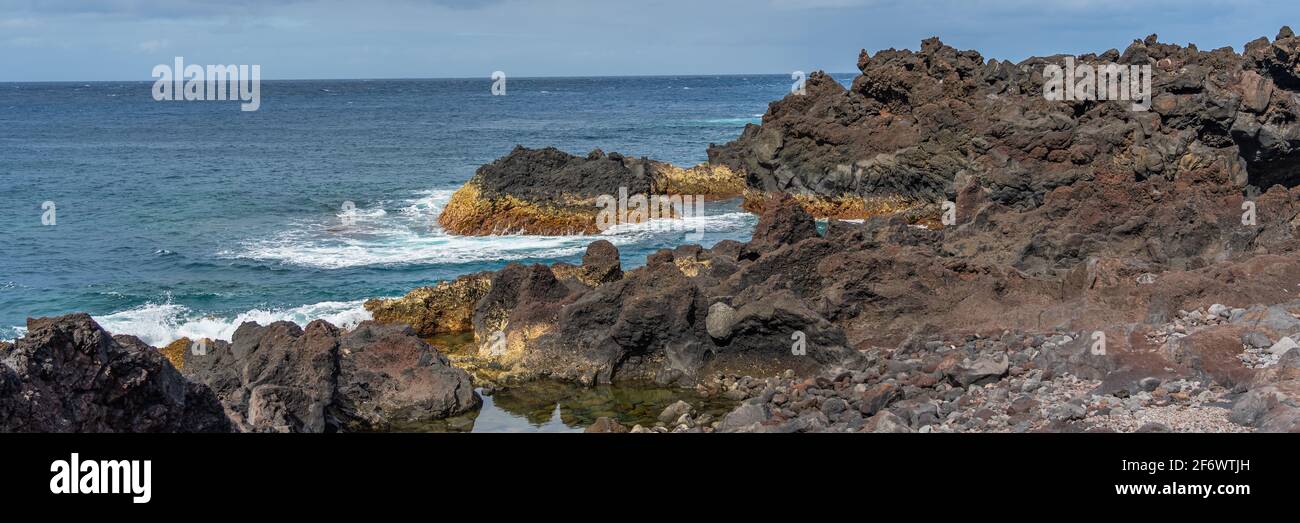 Natural volcanic rocks near Ponta da Ferraria, the place where hot ...