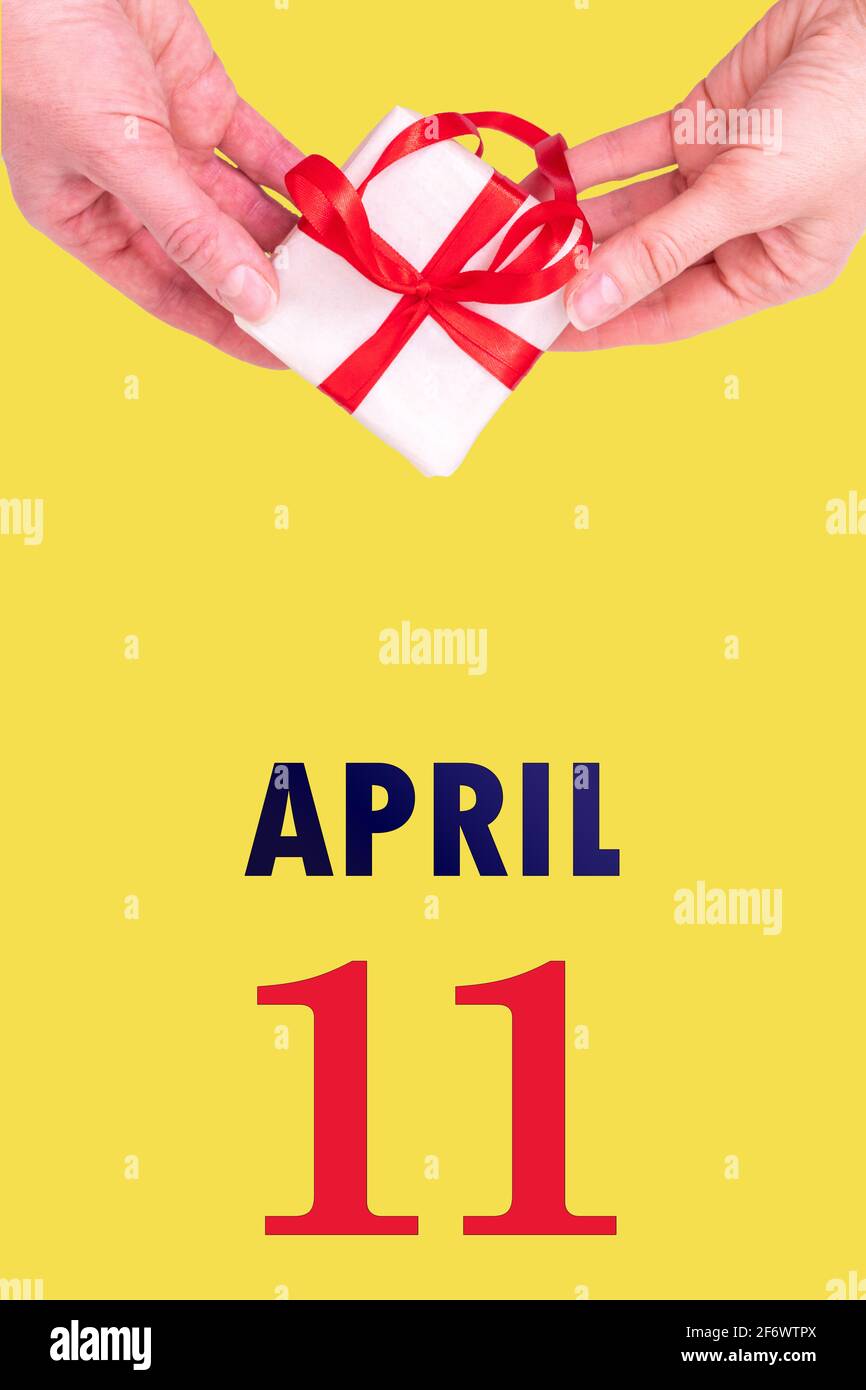April 11th. Festive Vertical Calendar With Hands Holding White Gift Box ...