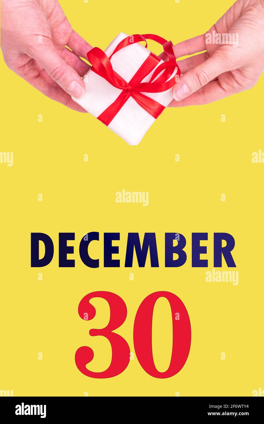 December 30th. Festive Vertical Calendar With Hands Holding White Gift ...