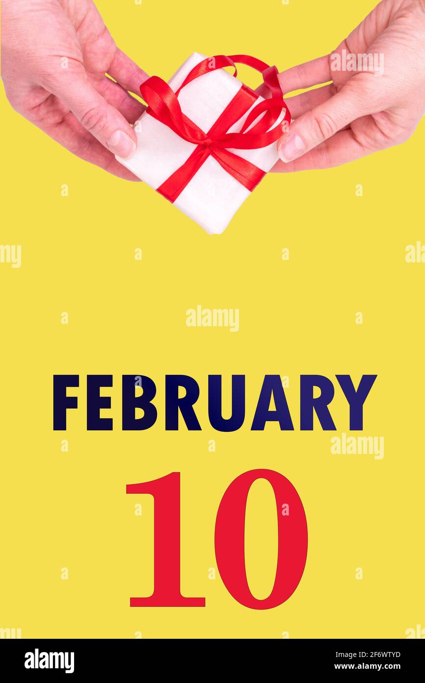 February 10th. Festive Vertical Calendar With Hands Holding White Gift ...