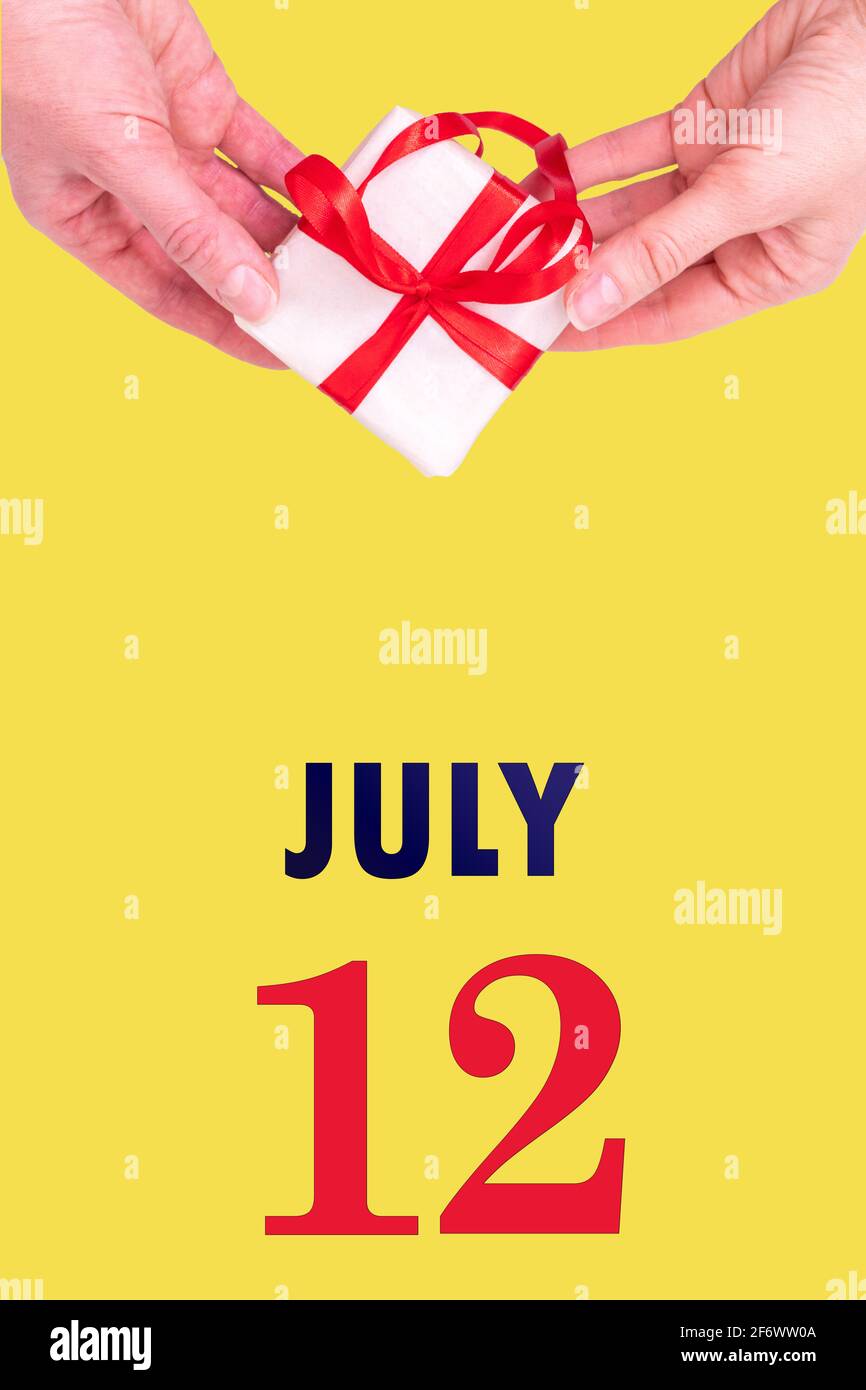 July 12th. Festive Vertical Calendar With Hands Holding White Gift Box ...