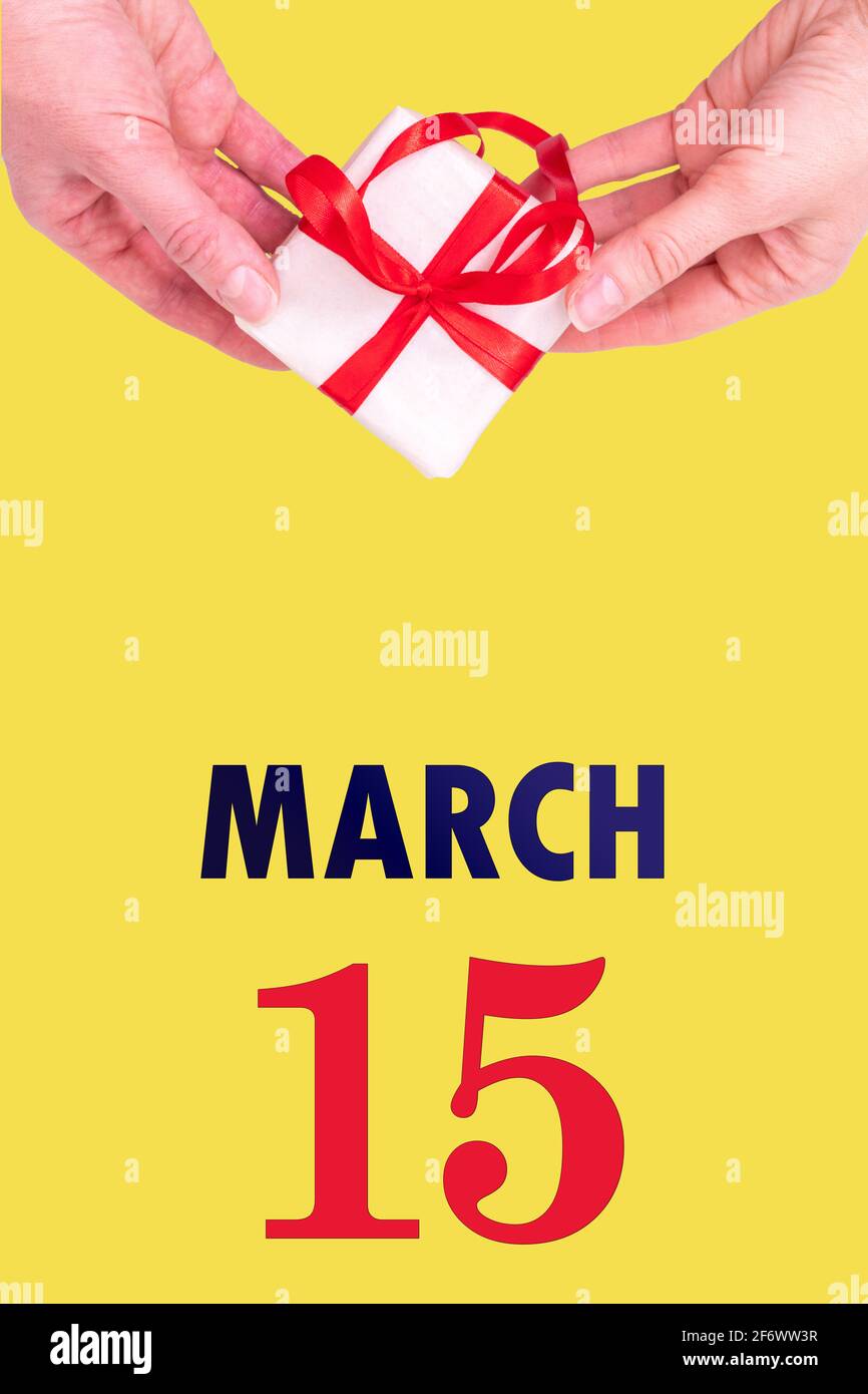 March 15th. Festive Vertical Calendar With Hands Holding White Gift Box ...