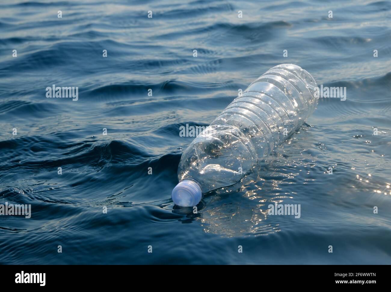 Plastic bottle floating in the ocean. Concept of pollution Stock Photo ...