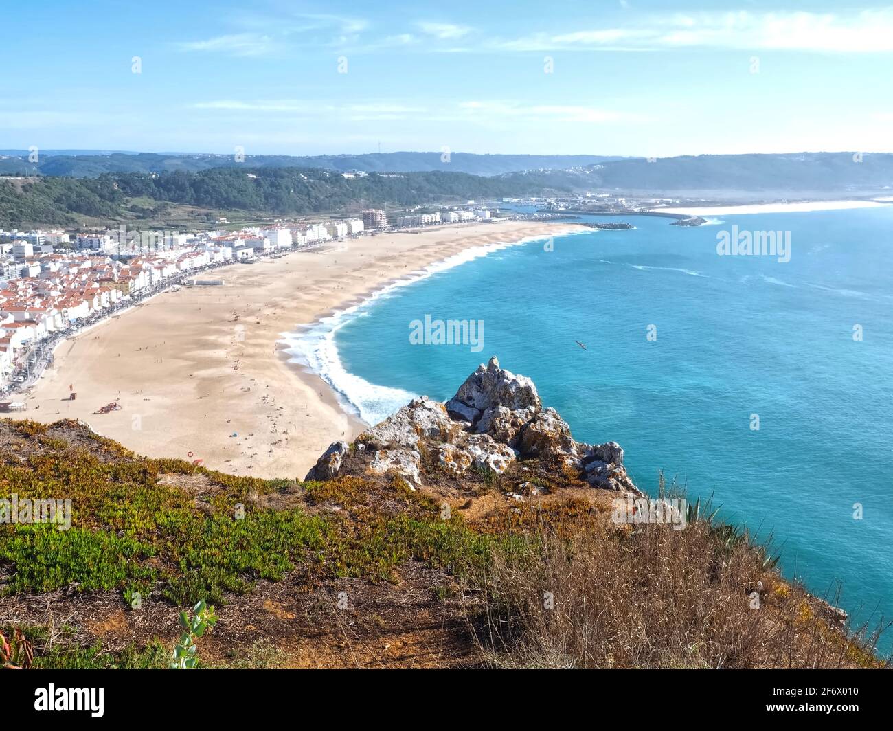 Aerial view of Nazare at the Centro coast of Portugal with long beach ...